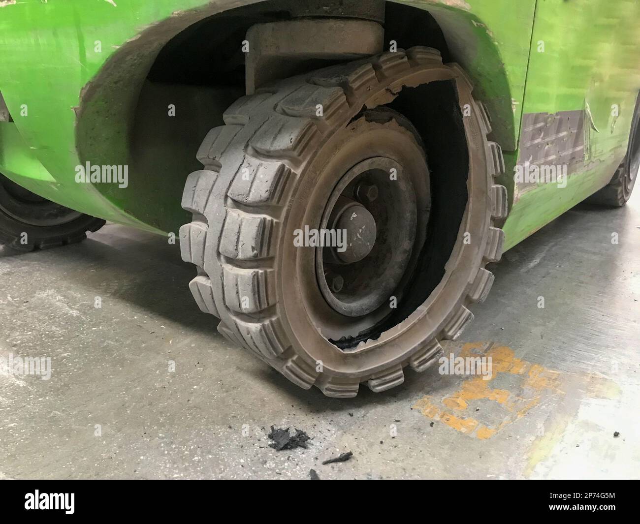 Close up photo of broken solid tire of a forklift Stock Photo - Alamy