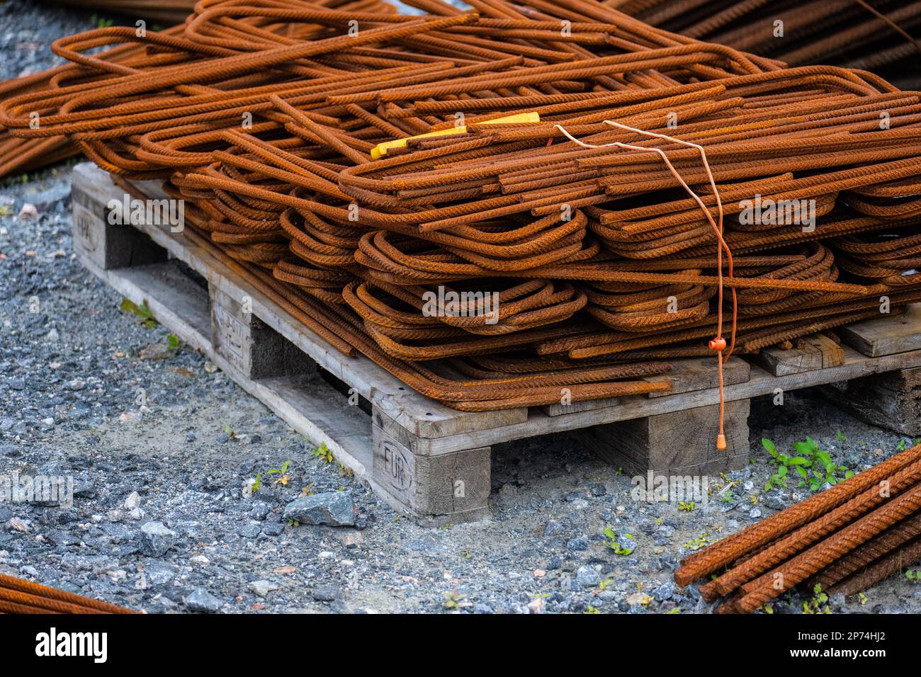 Piles of rusty rebar ready to be used at a construction site Stock ...
