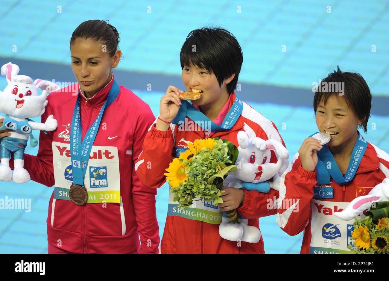Jul 21, 2011; Shanghai, CHINA; Chen Ruolin (C) of China celebrates ...