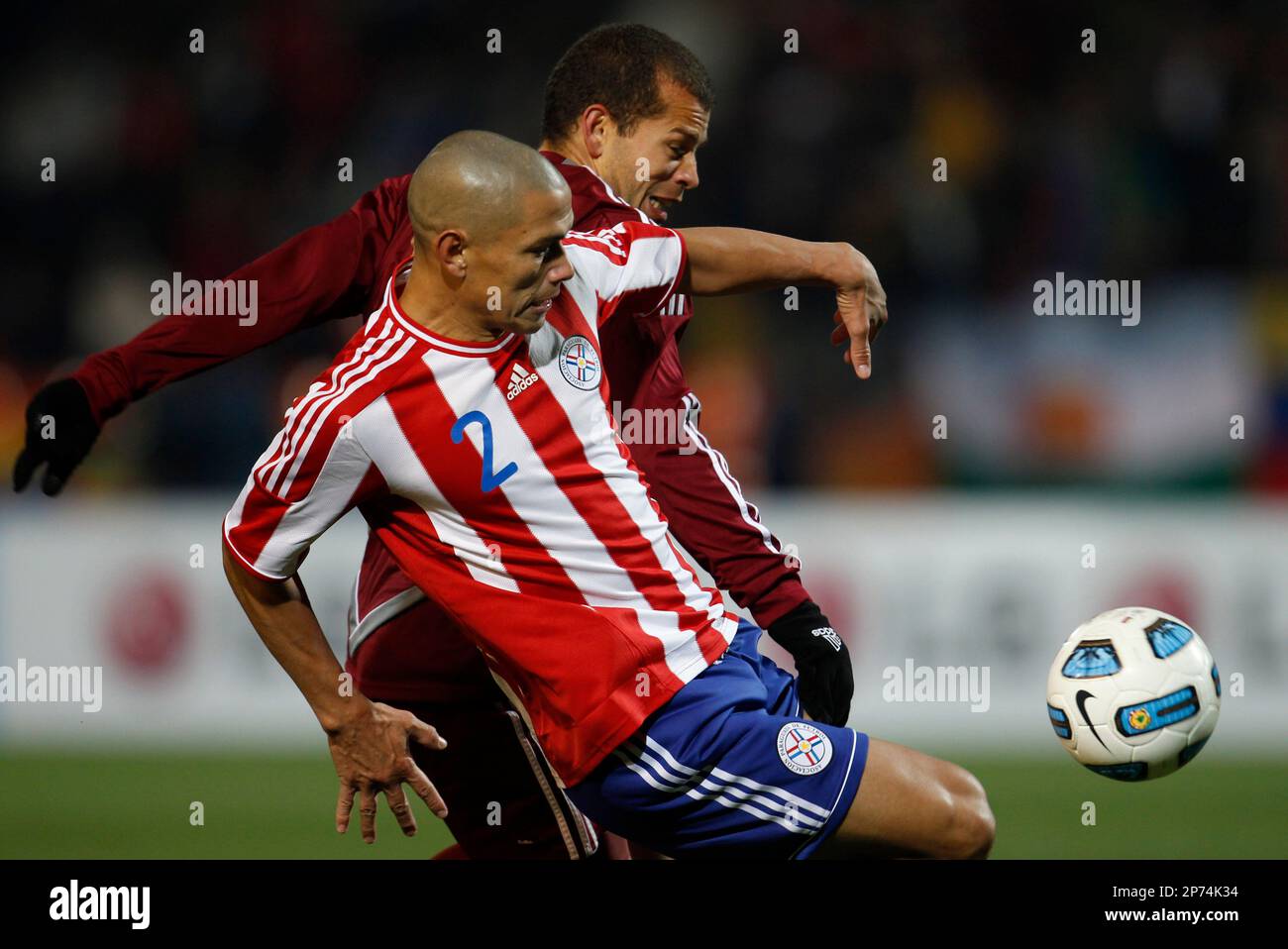 Paraguay's Dario Veron and Venezuela's Alejandro Moreno, rear, fight ...