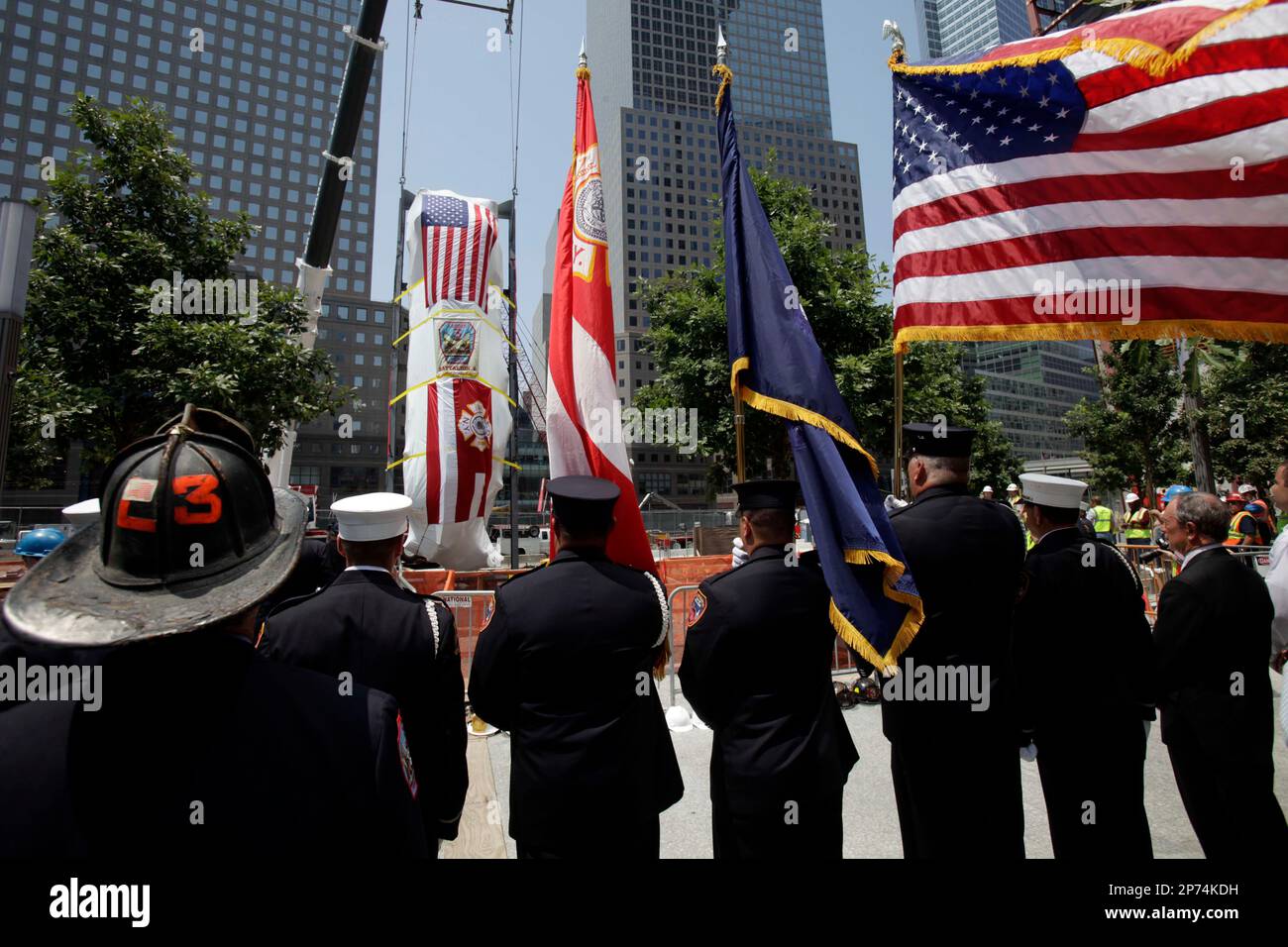 Firefighters and other dignitaries watch as the Fire Department of New ...