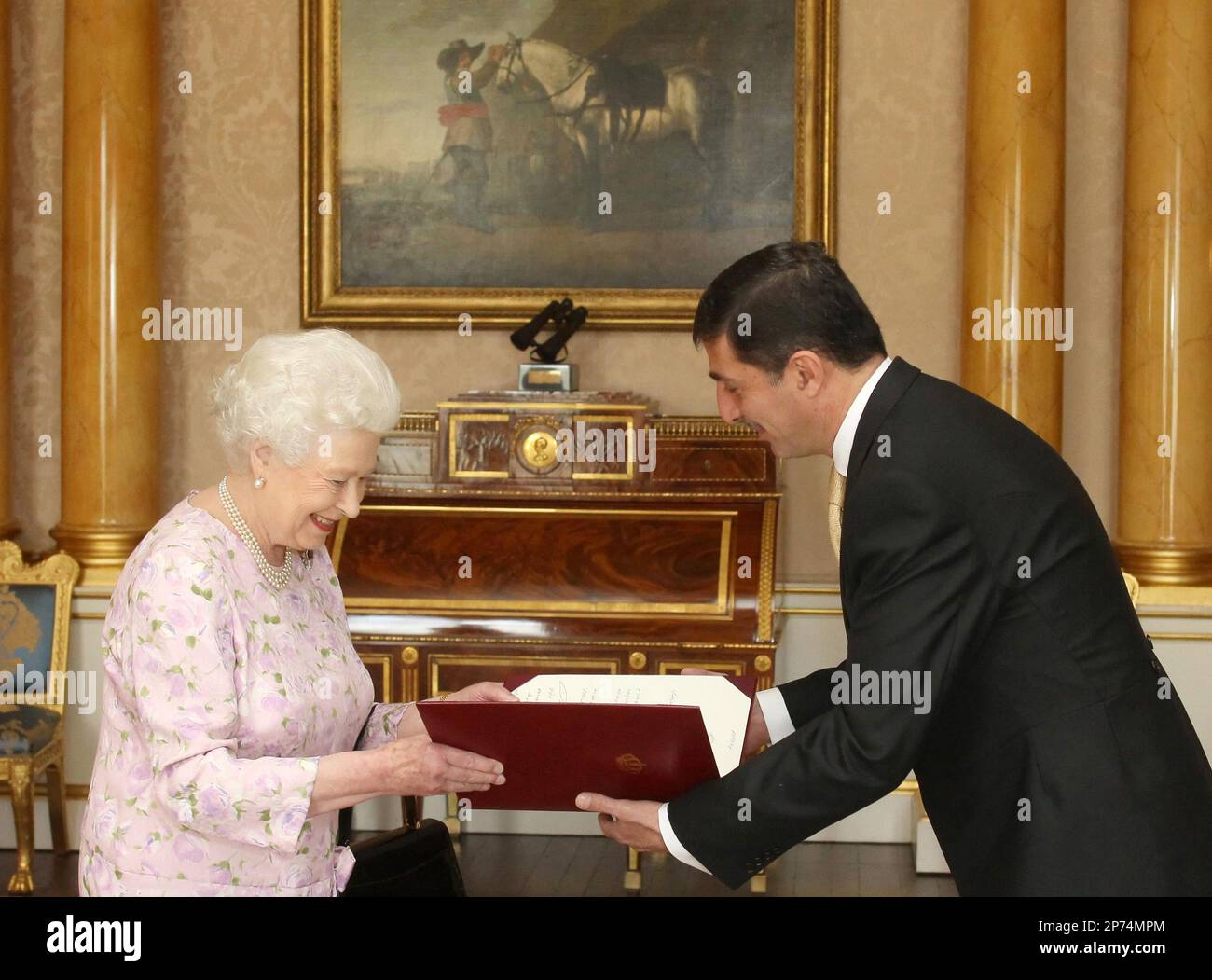 Britain's Queen Elizabeth II receives the Ambassador of Jordan Mazen ...