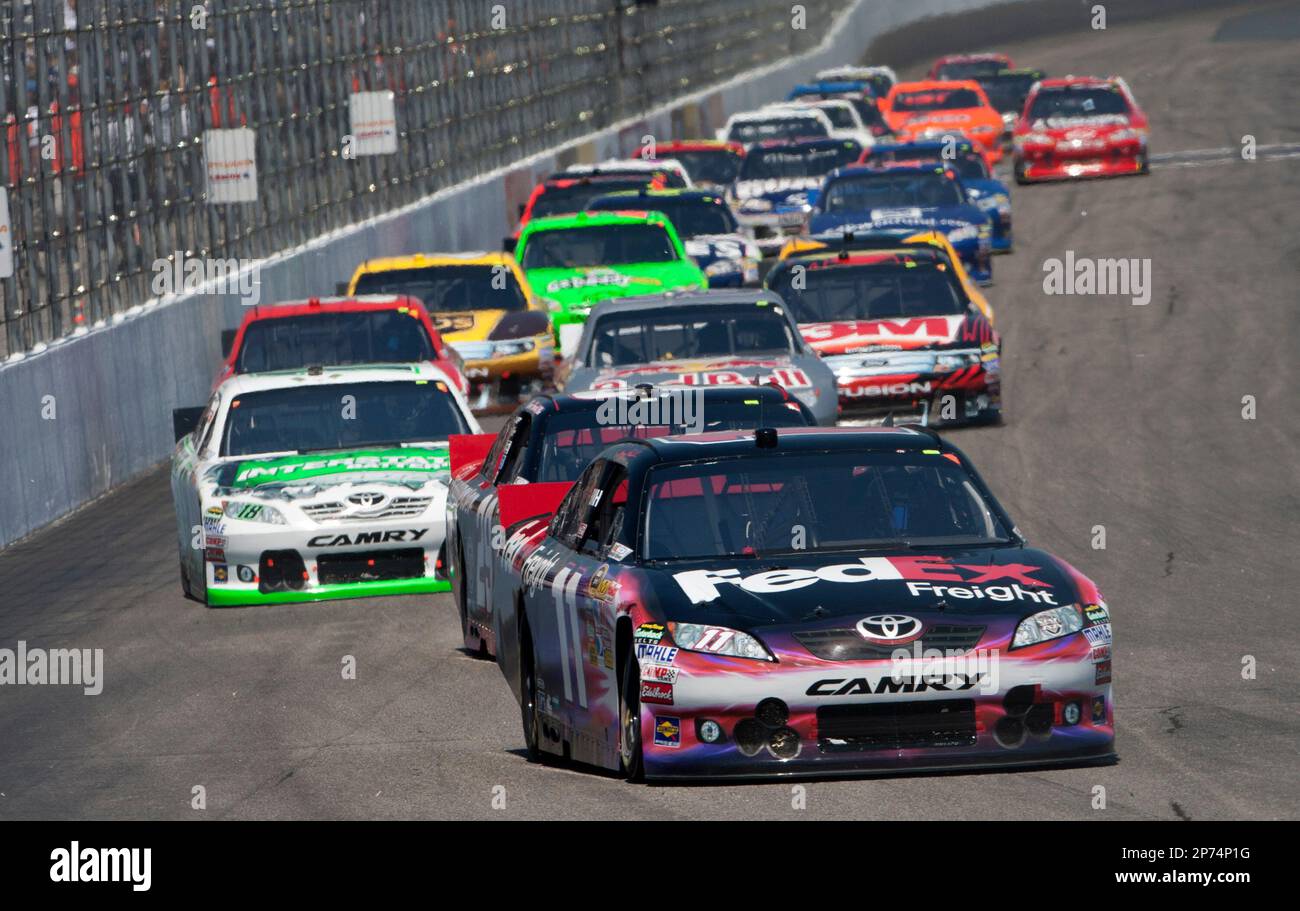 Loudon, NH - JUL 17, 2011: Denny Hamlin (11) races to turn one for the ...