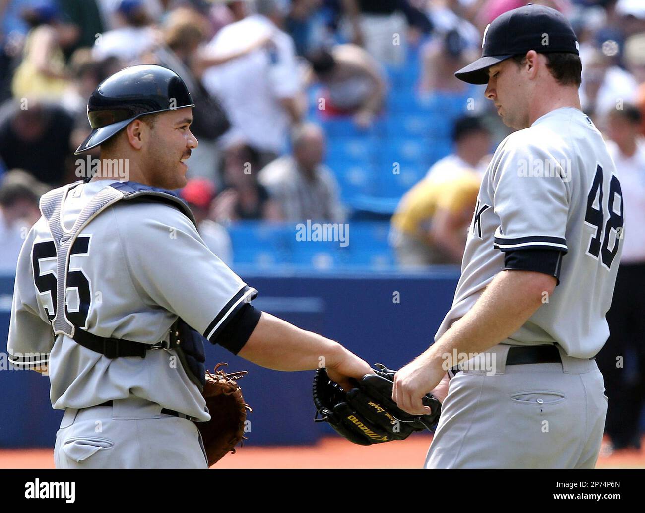 New York Yankees catcher Russell Martin, left, and pitcher Boone Logan ...