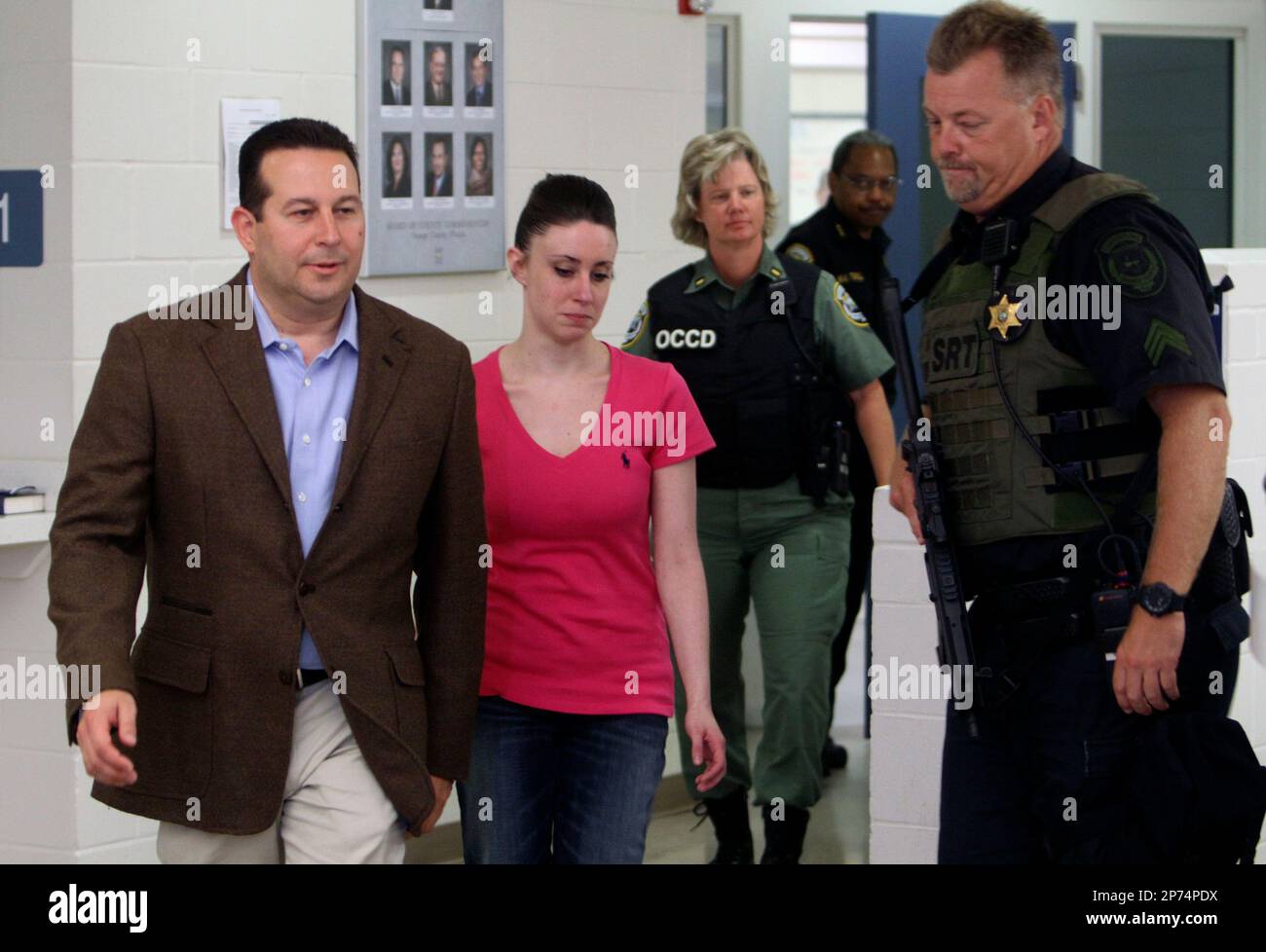 Casey Anthony, center, walks out of the the Orange County Jail with her ...