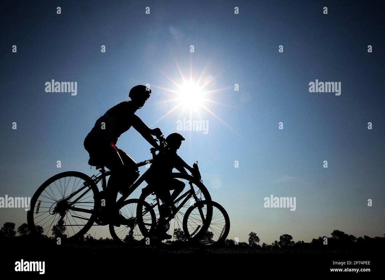 Cyclist travel down Texas Farm-to-Market Road 137 as part of the rural ...