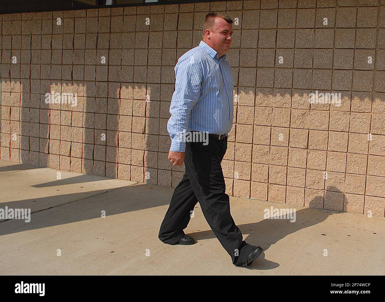 In a July 11, 2011 photo, Adam Baker leaves Catawba County Courthouse ...
