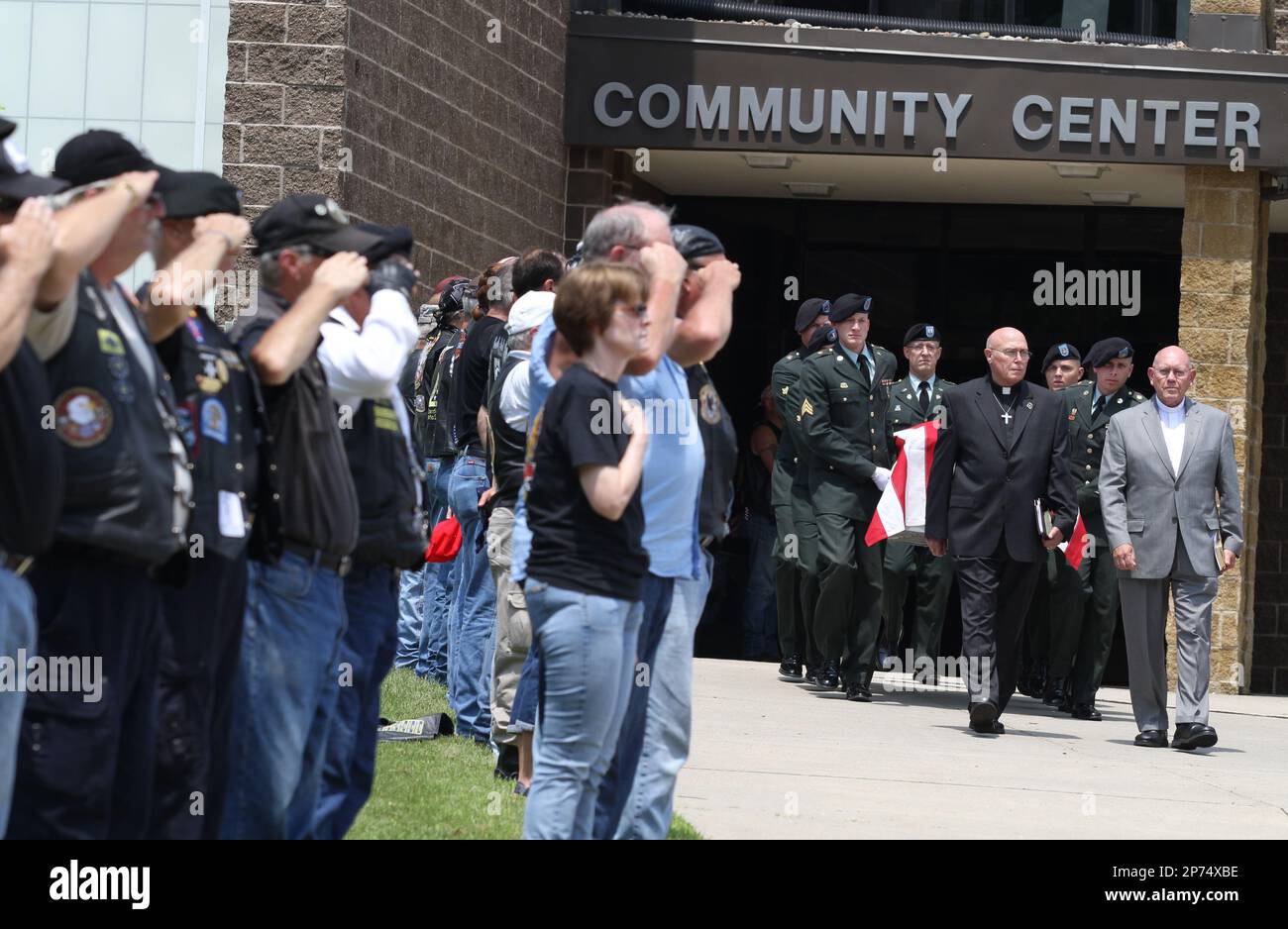 The casket of Cpt. Matthew Nielson is carried out of the Greene County ...