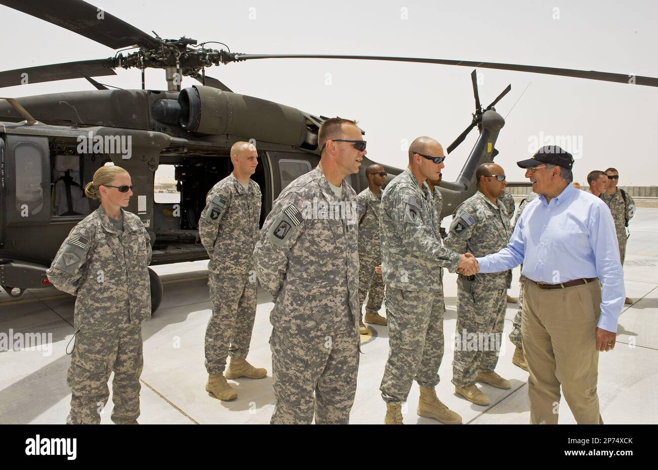 US Secretary of Defense Leon Panetta greets members of the helicopter ...