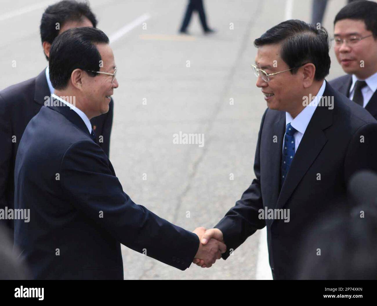 Chinese Vice Premier Zhang Dejiang, right, shakes hands with North ...