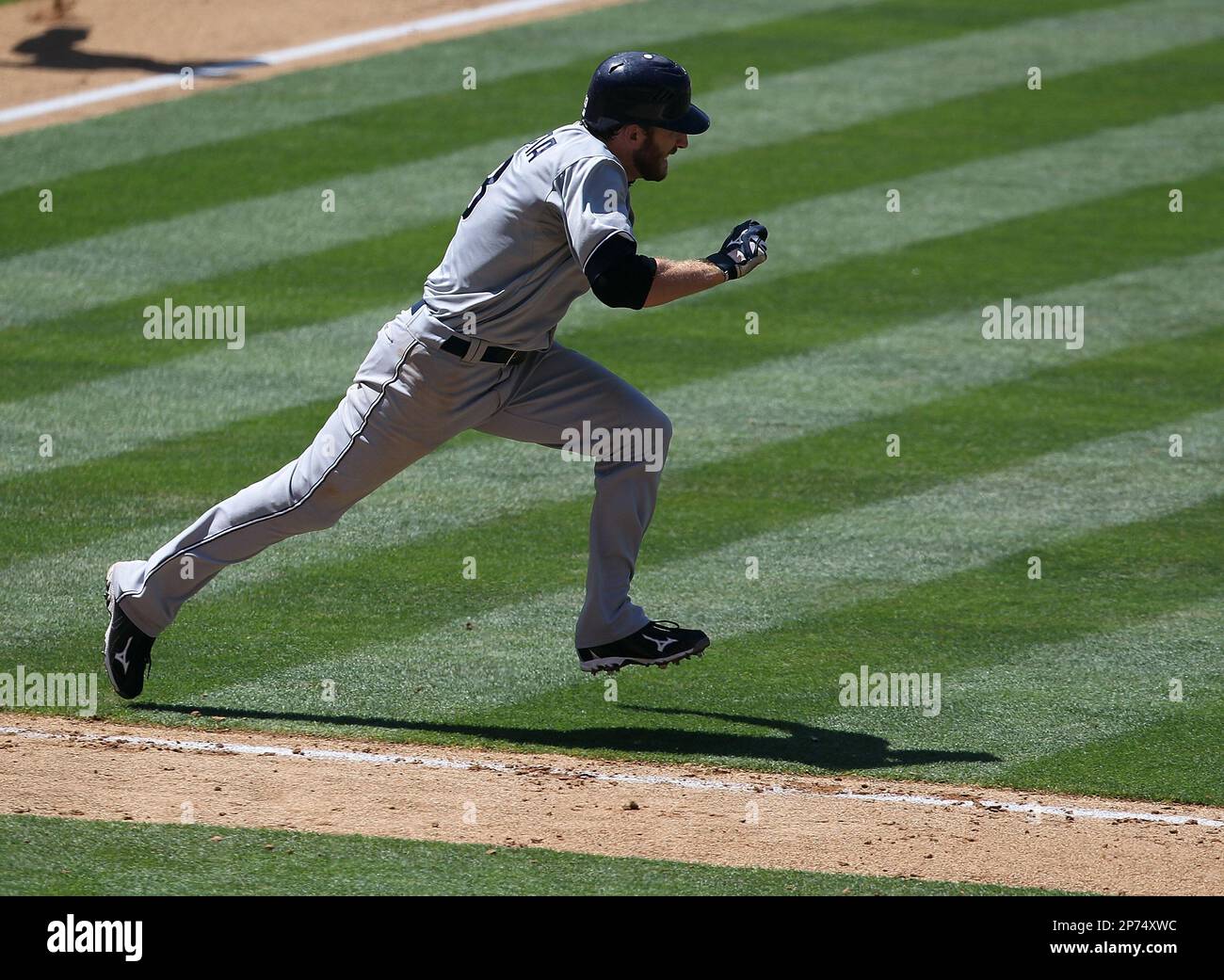 San Diego Padres left fielder Chris Denorfia runs to first base during ...