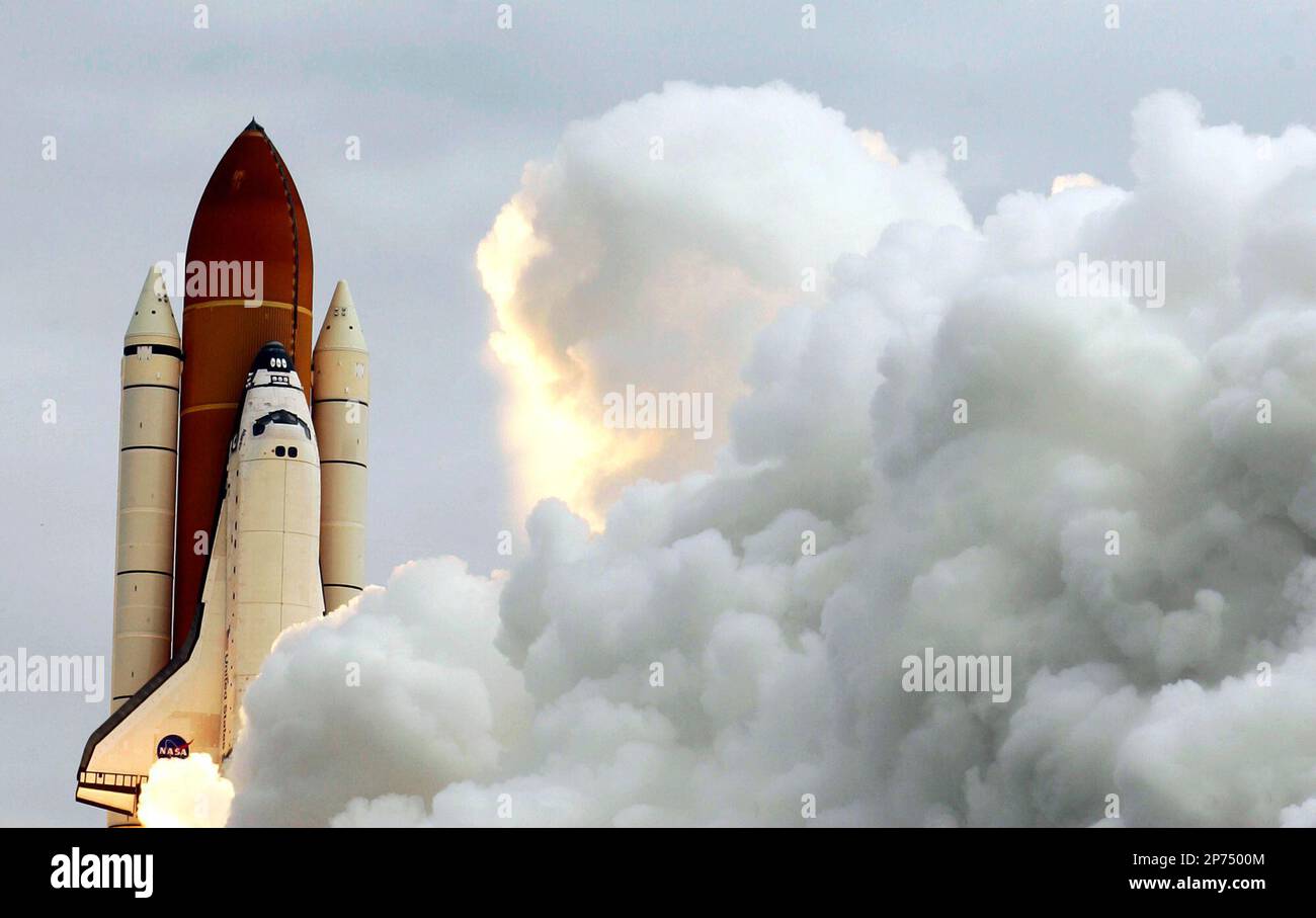 The space shuttle Atlantis lifts off from the Kennedy Space Center ...