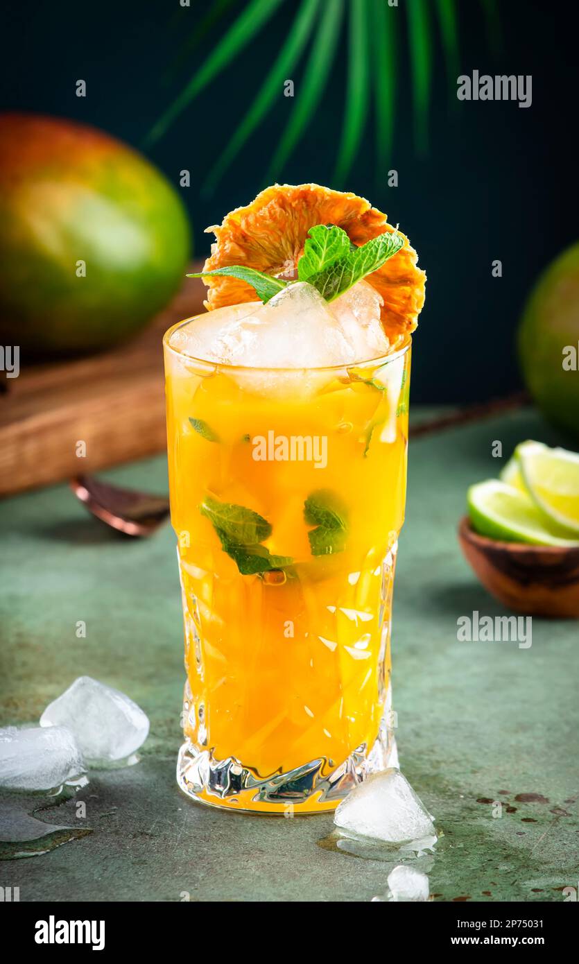 Alcoholic cocktail with vodka, pineapple juice, mango, liquor, ice ...