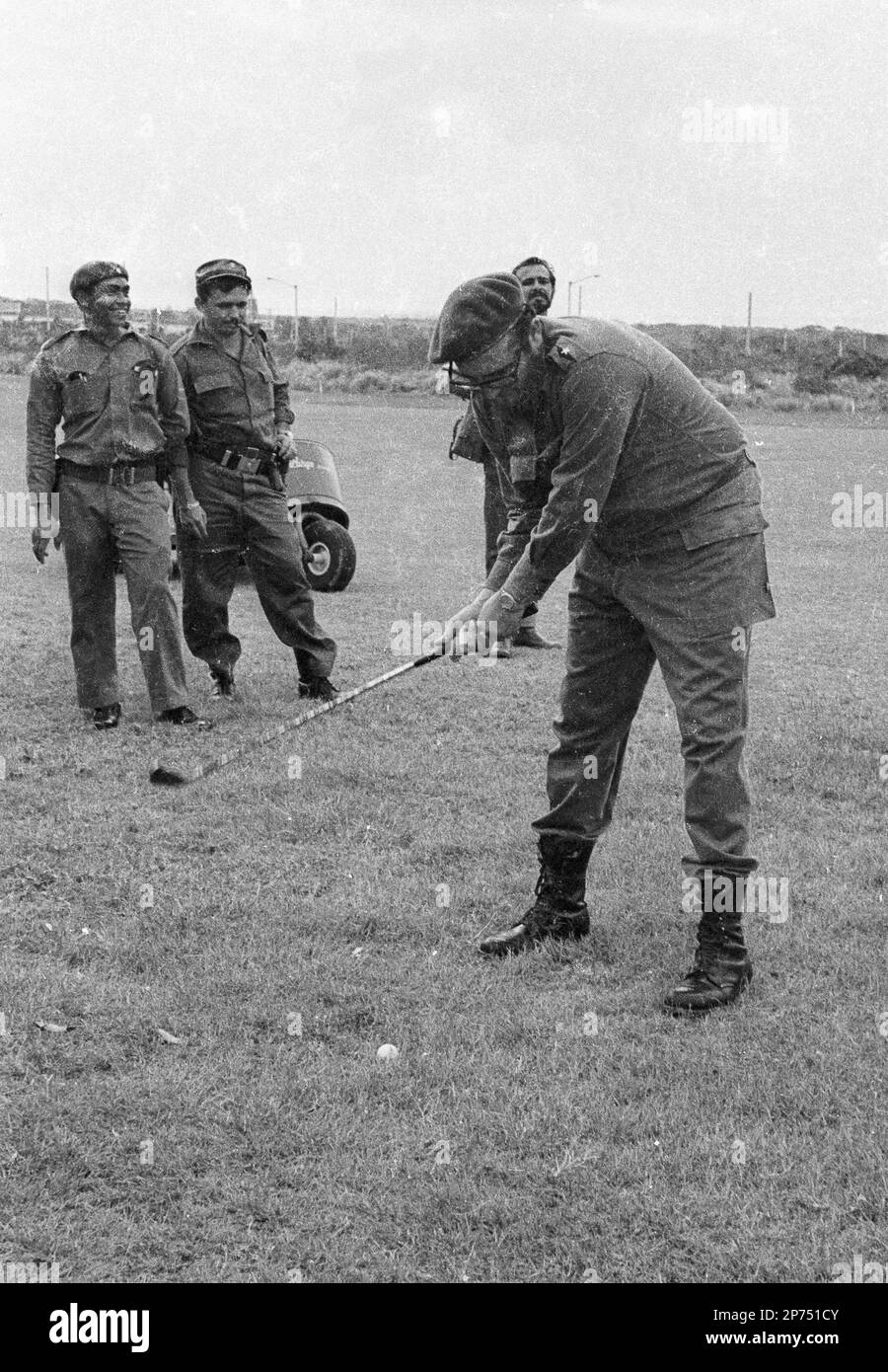 Cuban leader Fidel Castro takes a swing during a game of golf with ...