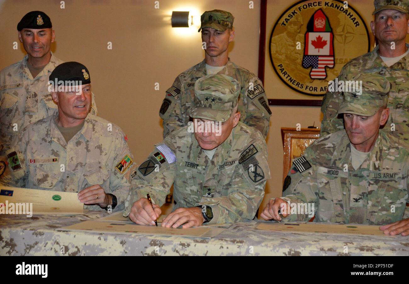 Canadian Brig.-Gen. Dean Milner, left, watches as U.S. Maj.-Gen. James ...