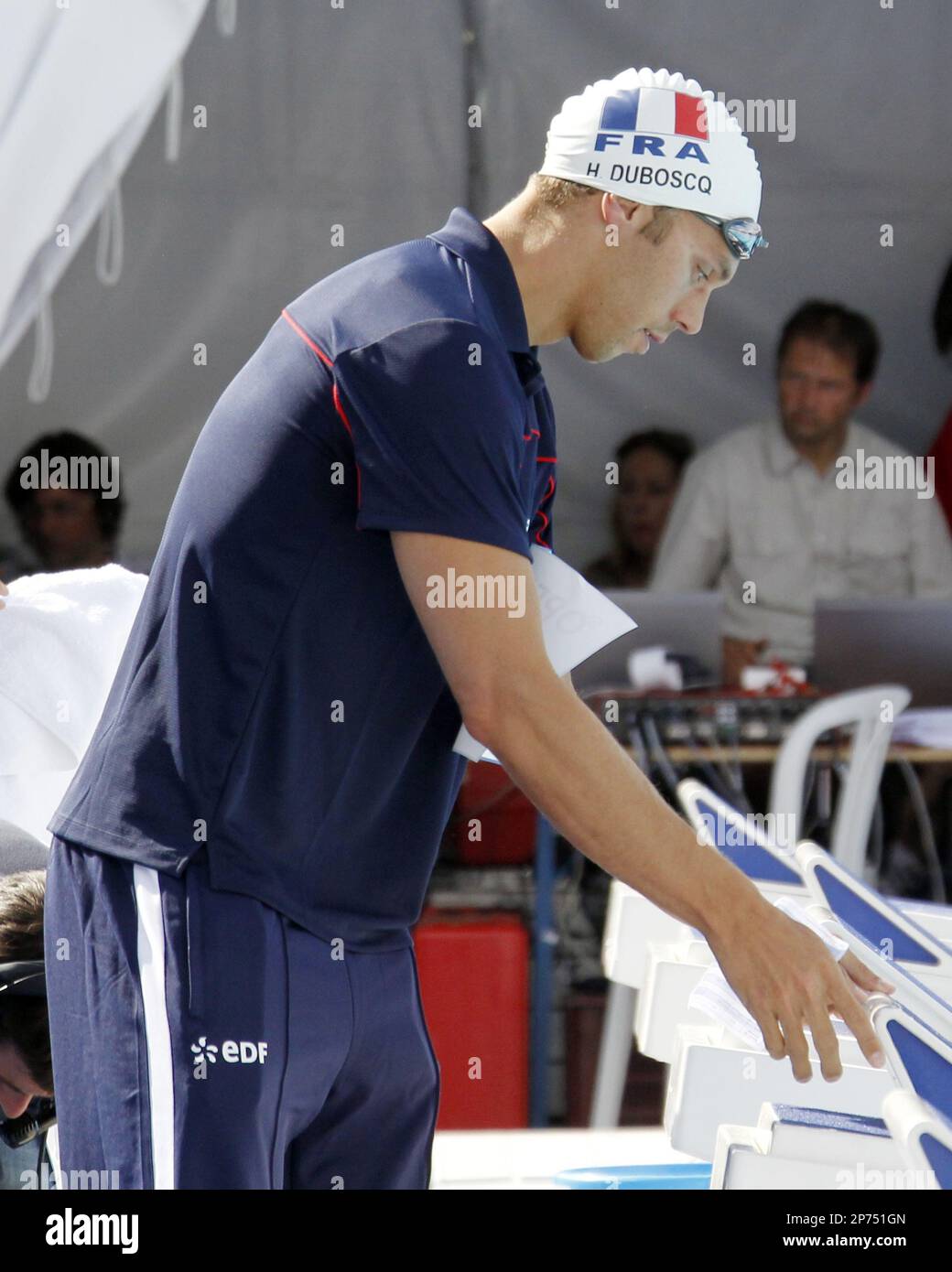 Hugues Duboscq, of France, prepares for the start of the mens 200 meter ...