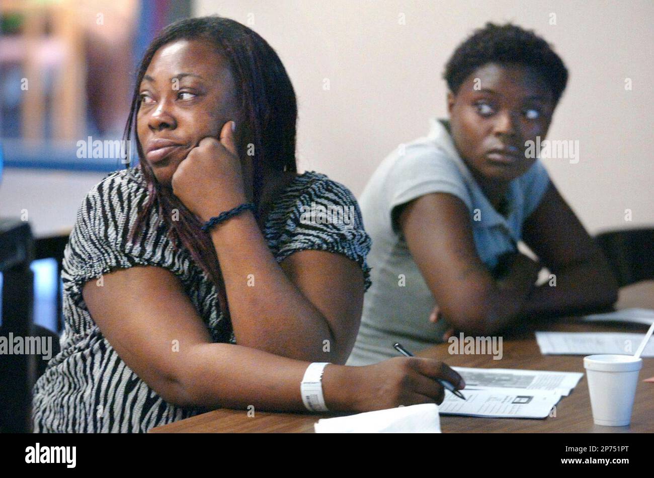 In this photo taken June 28, 2011, Catrina Bennett, left, and SuVanna ...
