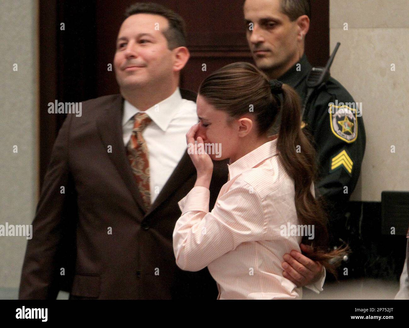 Defense attorney Jose Baez and Casey Anthony, hug after the jury ...