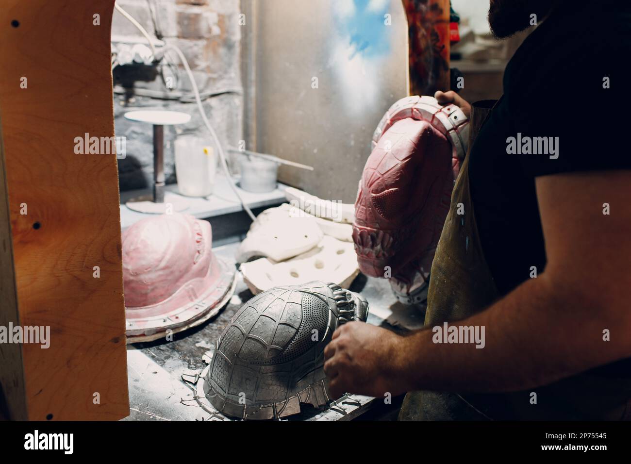 Artisan craftsman create mask based on plaster cast. Gypsum mold and ...