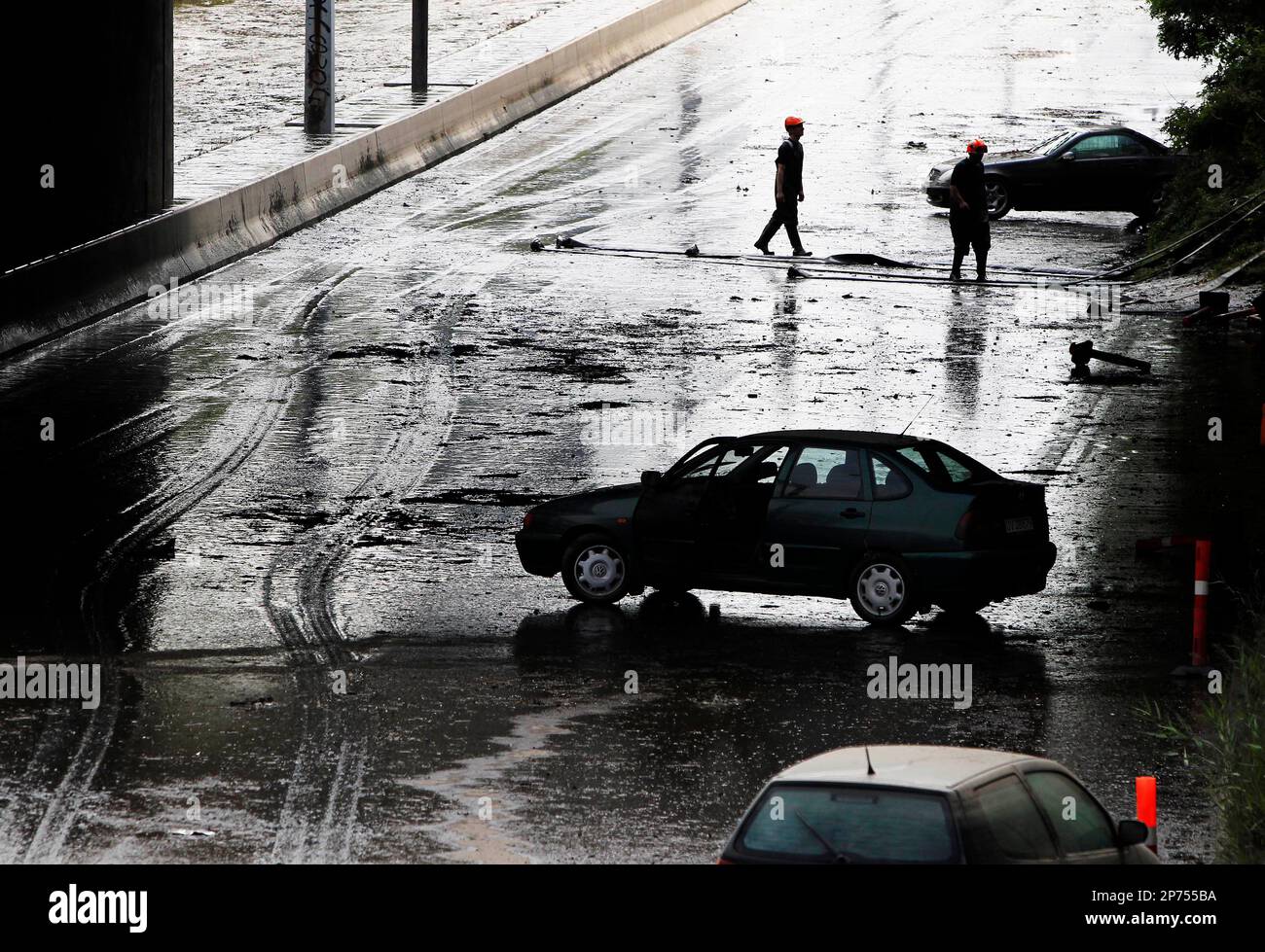 The scene after heavy rain, in Copenhagen, Sunday, July 3, 2011. (AP ...
