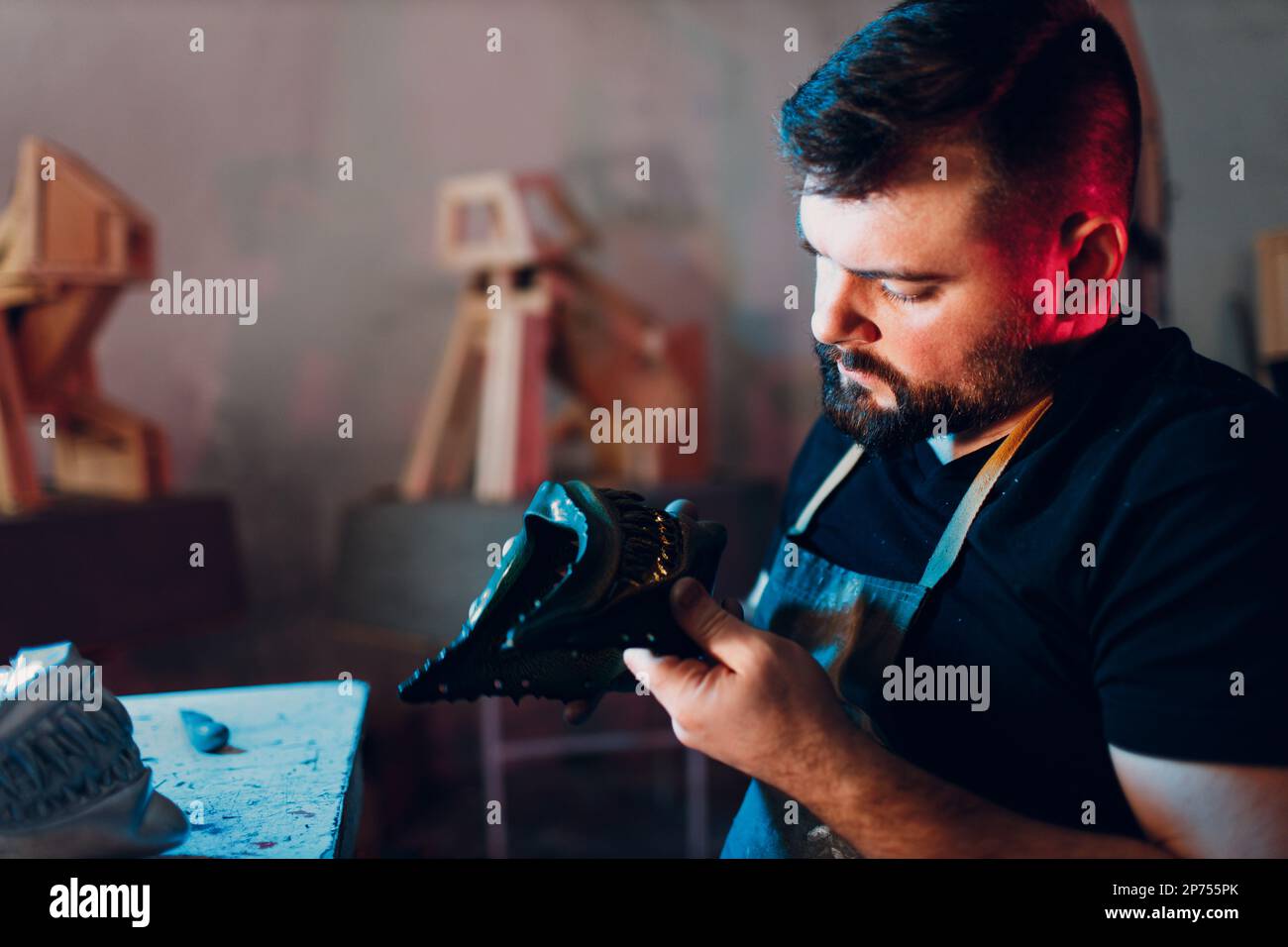Artisan craftsman create mask based on plaster cast. Gypsum mold and ...