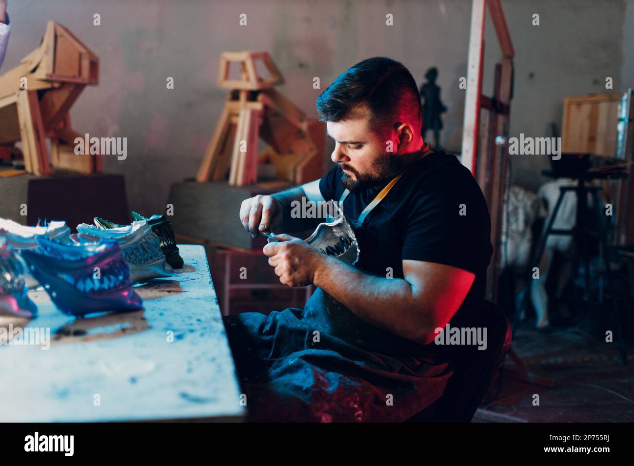 Artisan craftsman create mask based on plaster cast. Gypsum mold and ...