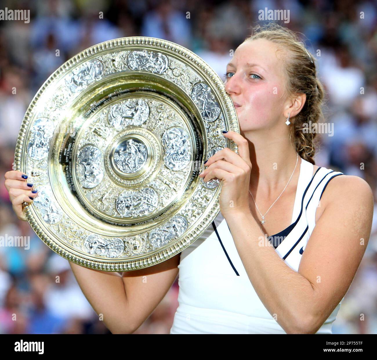 Petra Kvitova of the Czech Republic kisses a winning plate at the ...