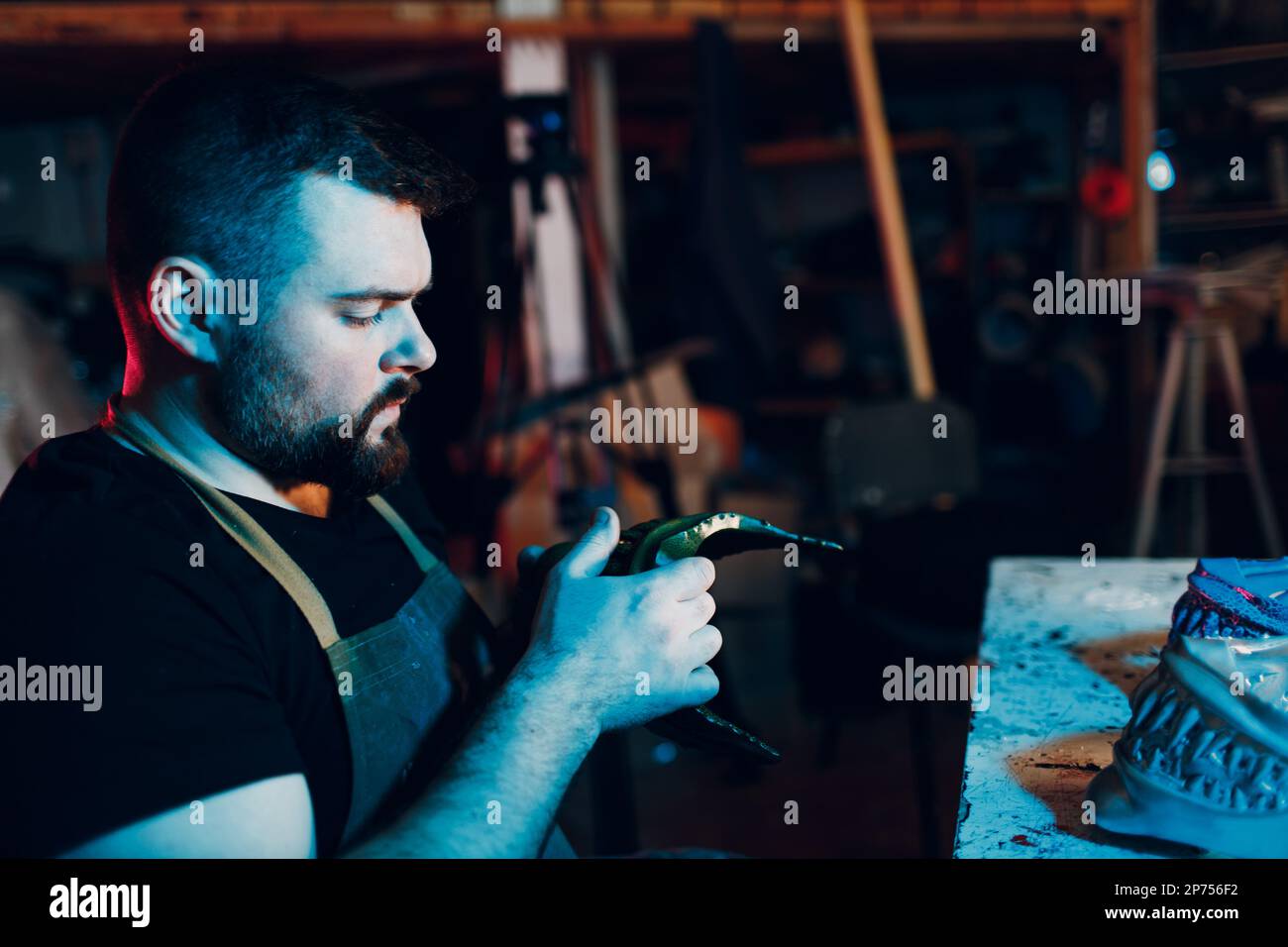 Artisan craftsman create mask based on plaster cast. Gypsum mold and ...