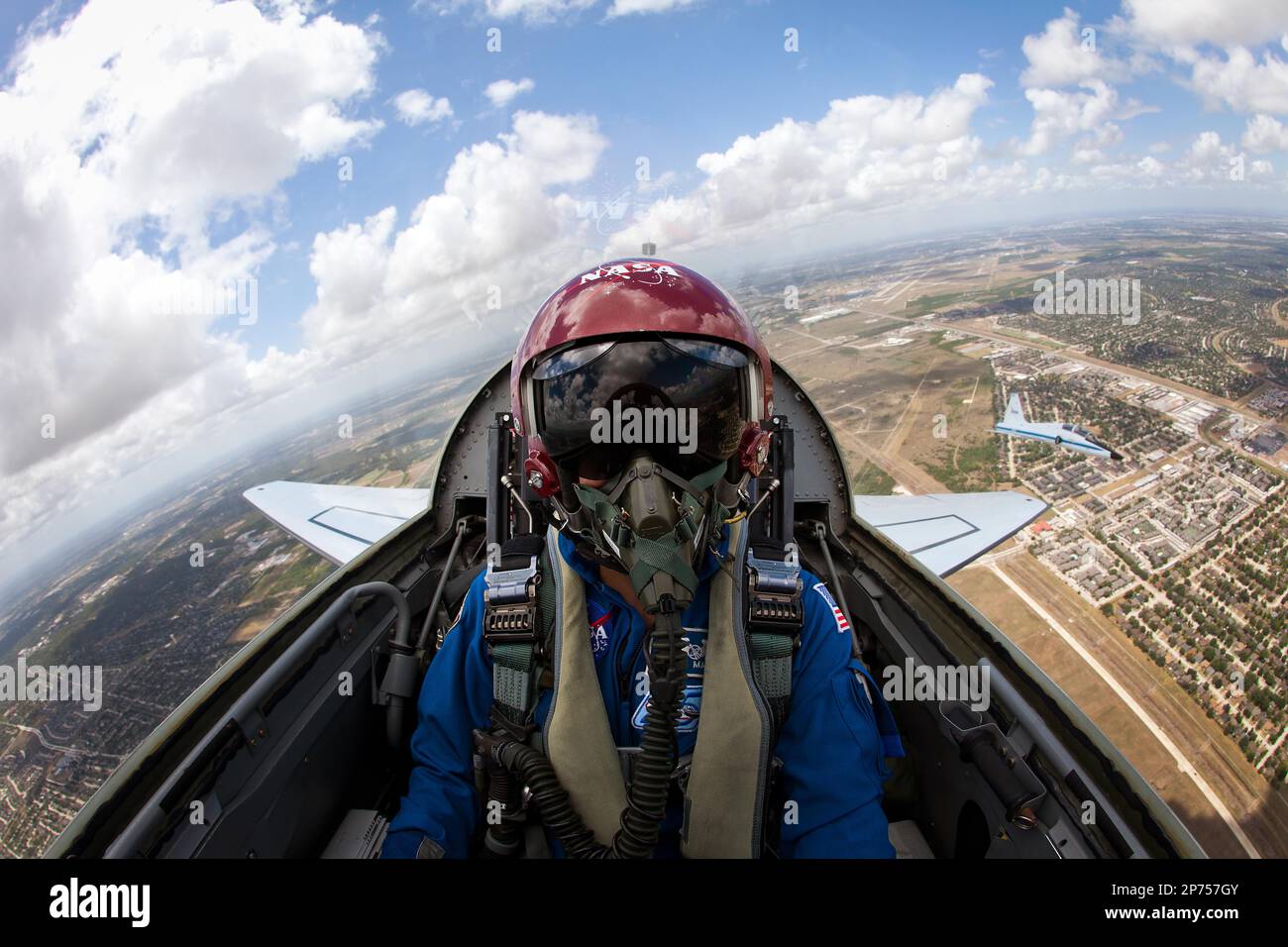 NASA astronaut Sandy Magnus, STS-135 mission specialist, flies in a T ...