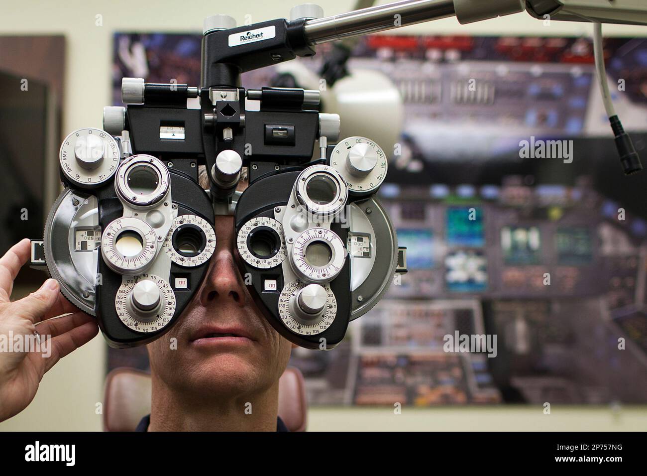 NASA astronaut Chris Ferguson, STS-135 commander, undergoes an eye ...