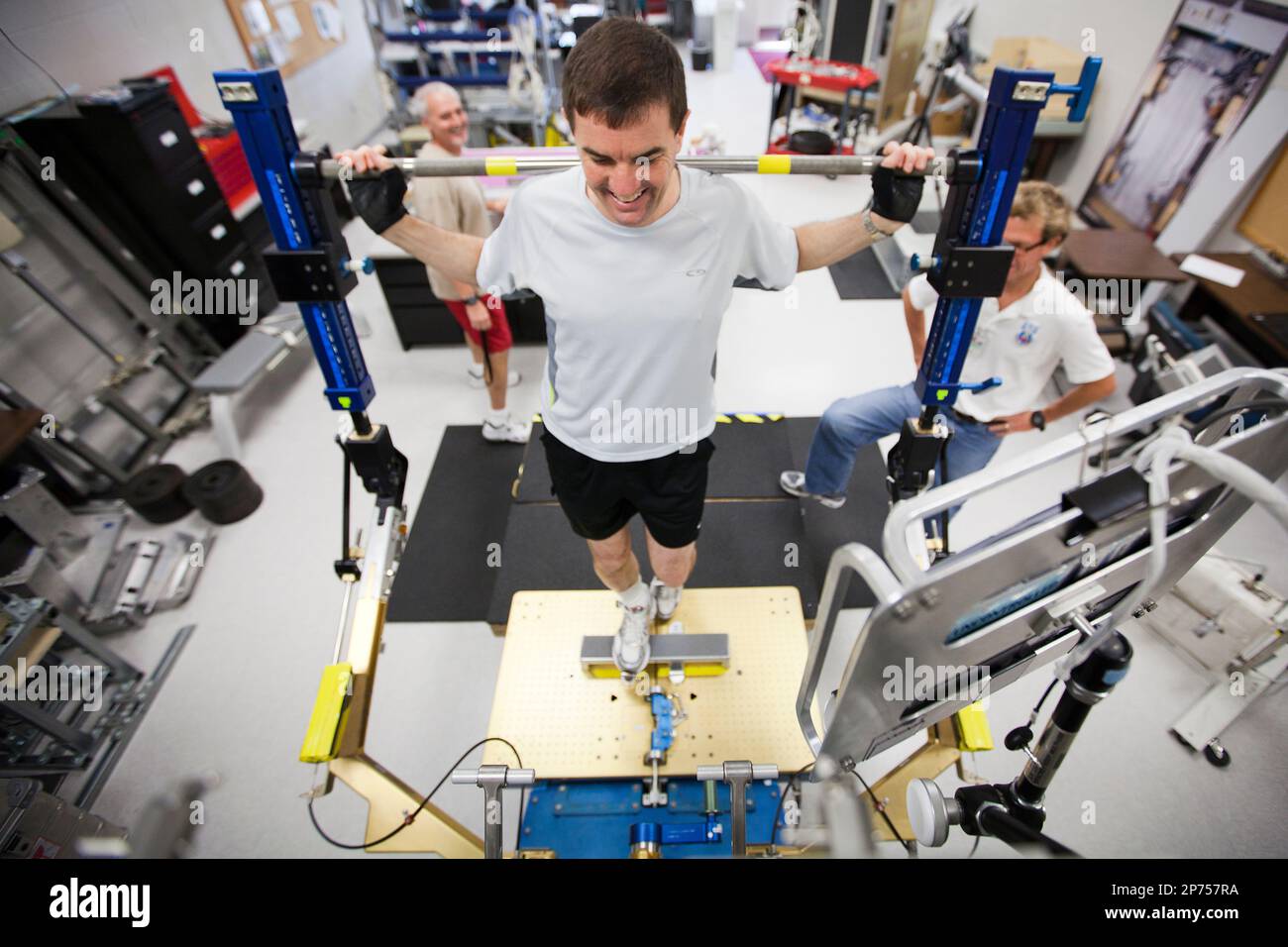 NASA astronaut Rex Walheim trains on the Advanced Resistive Exercise ...