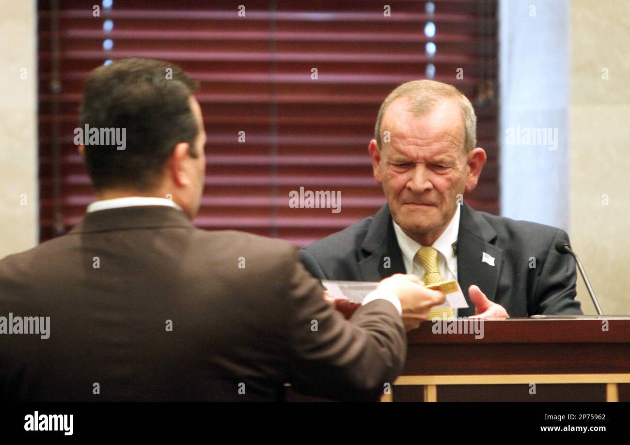 Private investigator Dominic Casey, right, looks at documents handed to ...