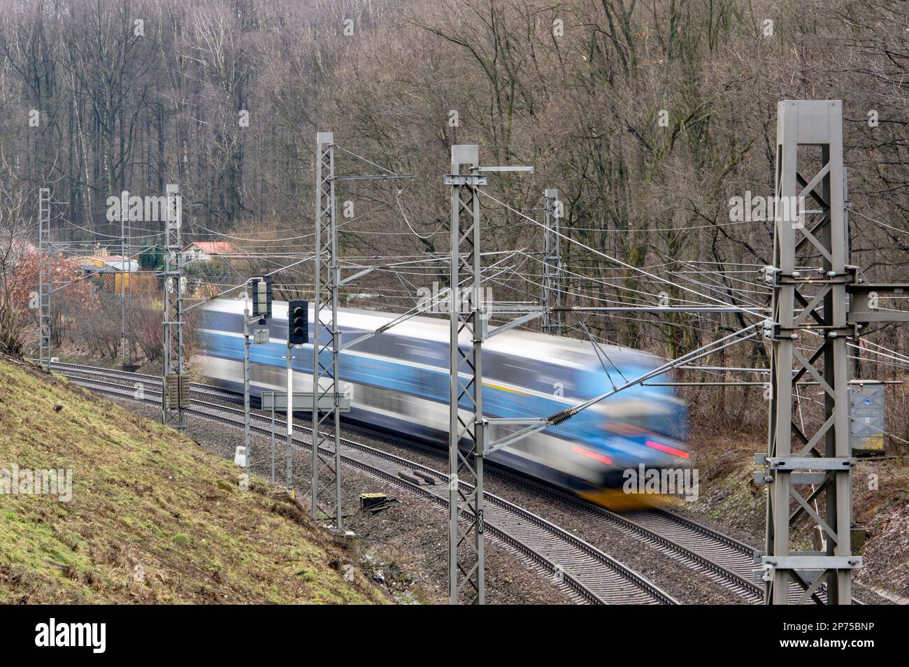 Blurred fast driving Czech train with double railroad using motion blur ...