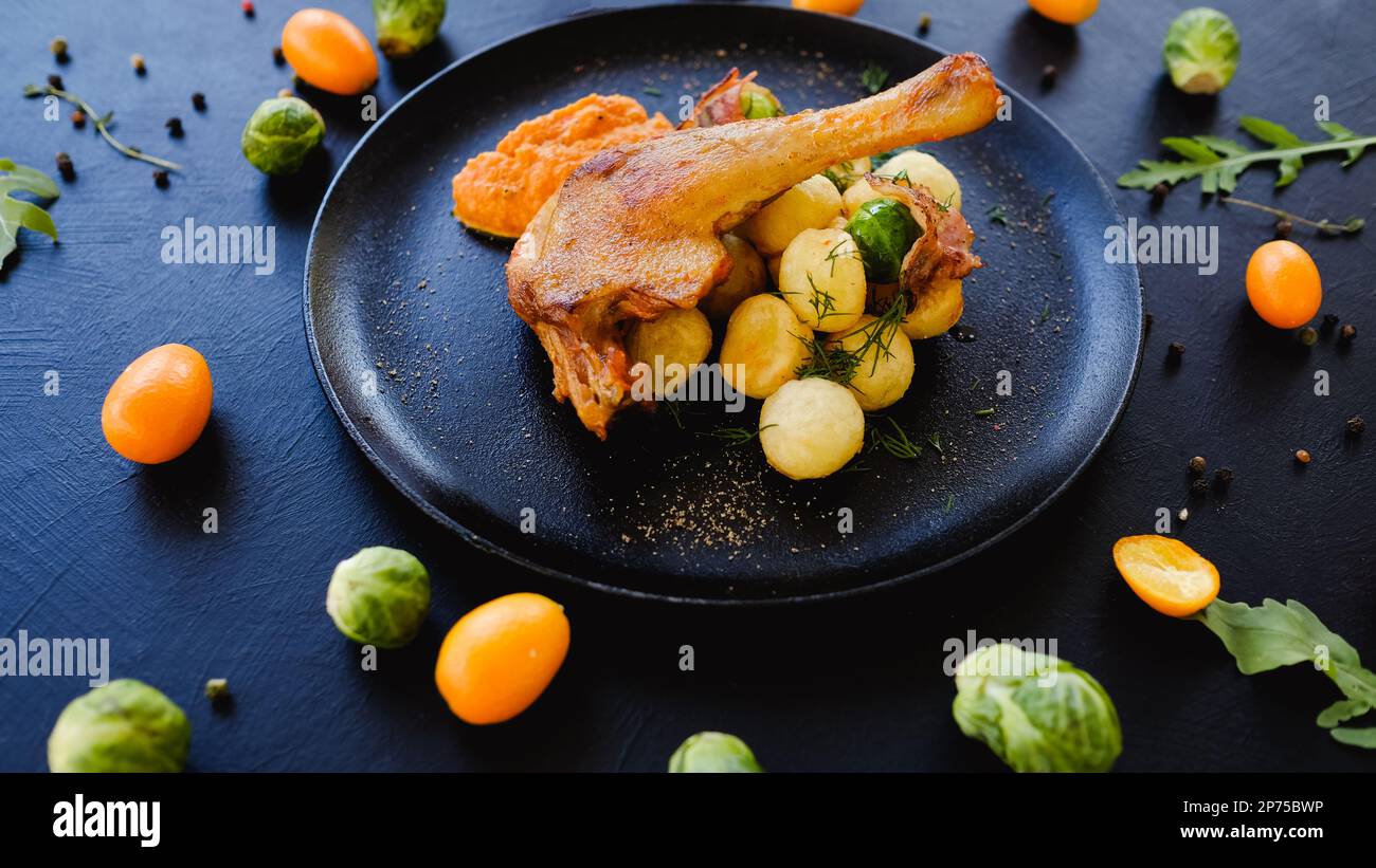 ready made chicken leg dish breakfast Stock Photo - Alamy