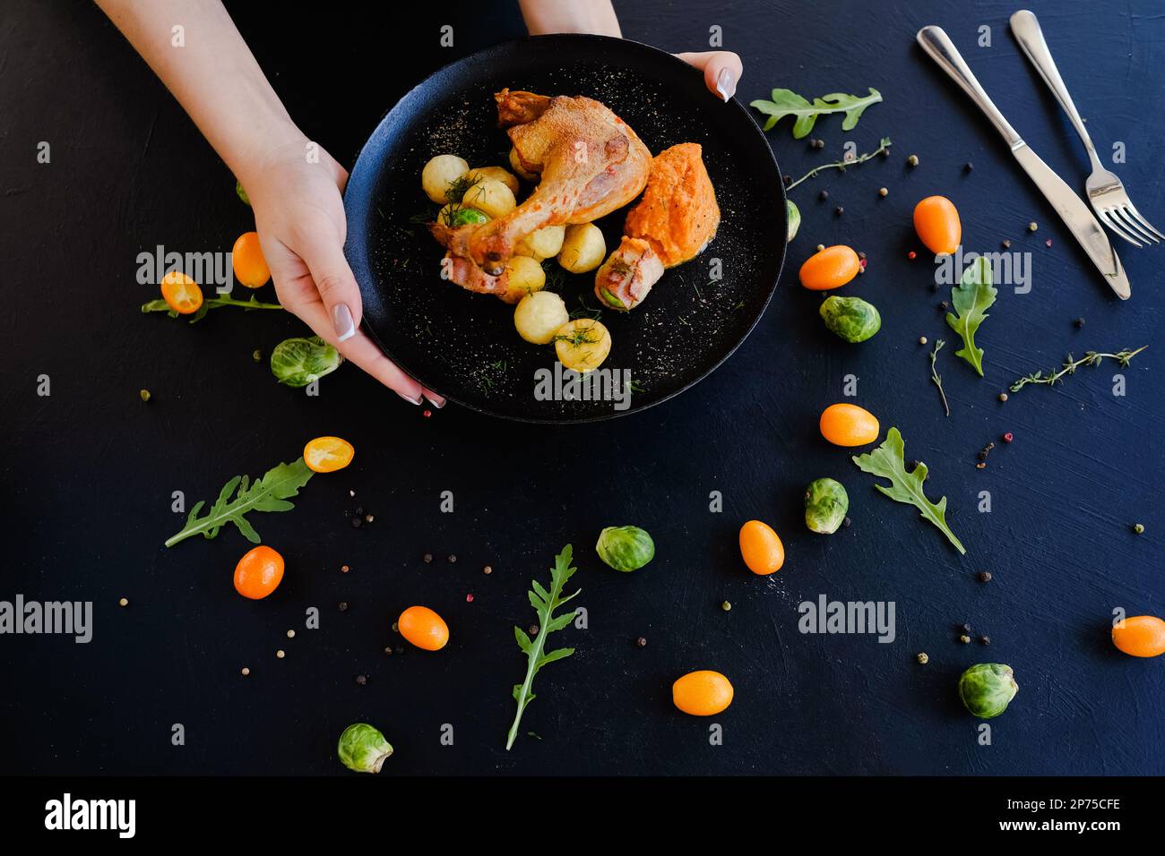 restaurant serving chicken leg dish Stock Photo - Alamy