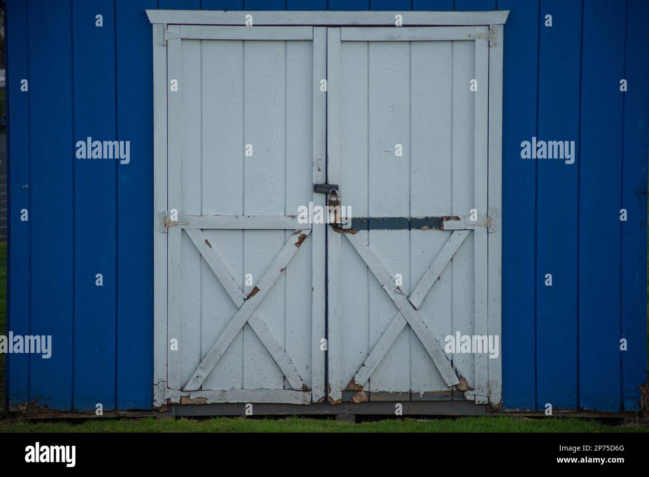 Blue wooden outdoor shed rustic double white closed doors Stock Photo ...