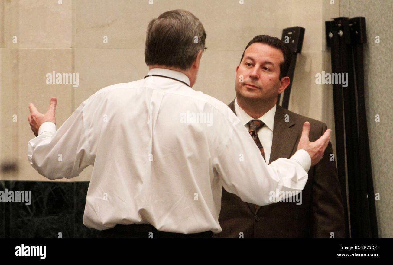 Defense attorney Jose Baez, right, talks with co-counsel Cheney Mason ...