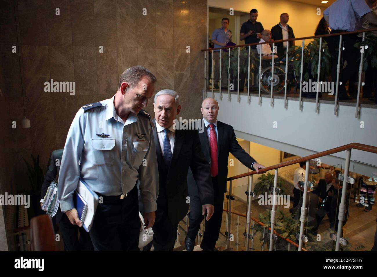 Israeli Prime Minister Benjamin Netanyahu, center, speaks to his ...