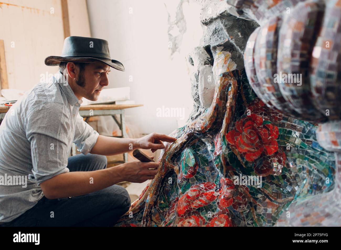 Man mosaics master in hat canadian making smalt glass mosaic panel ...