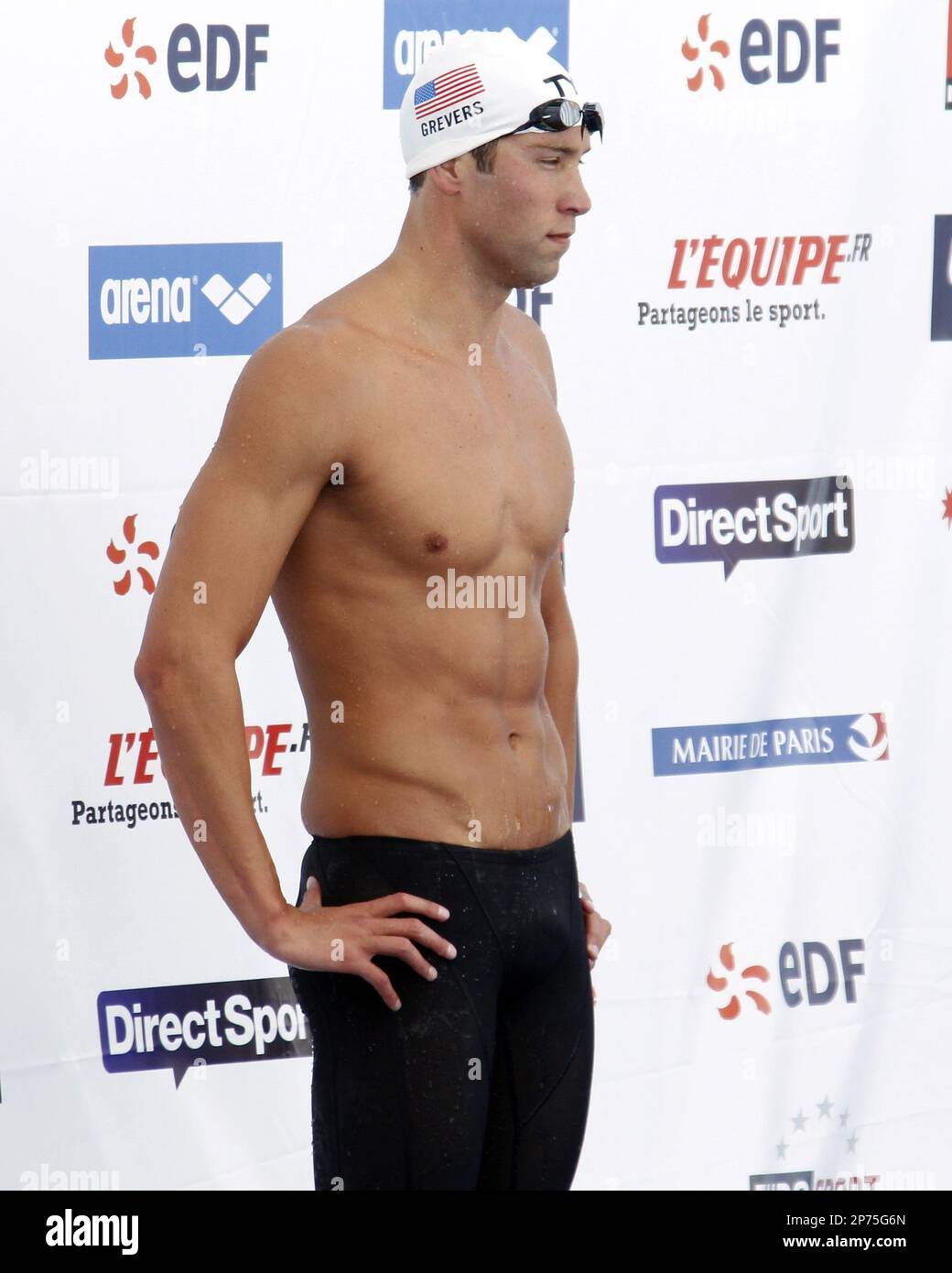 Matthew Grevers, of the USA, on the podium after winning the mens 100 ...