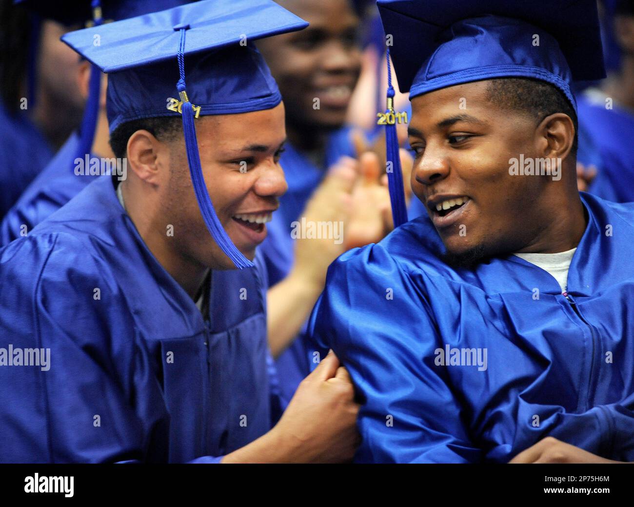 Joseph Williams, left, and Derrick Holmes, right, share a laugh during ...