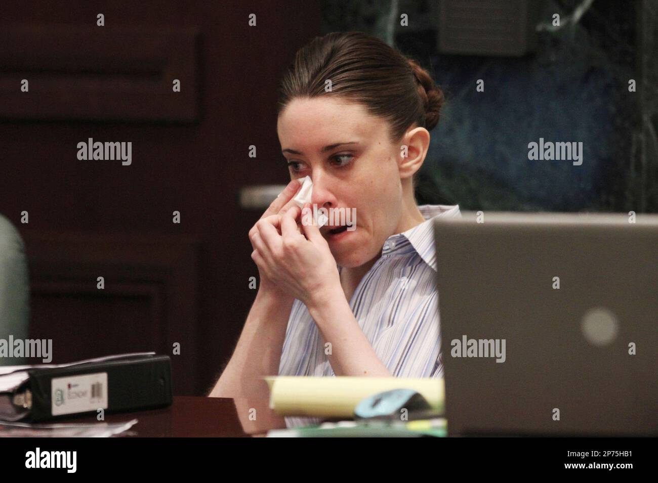 Casey Anthony wipes tears from her eye as she listens to her mother ...