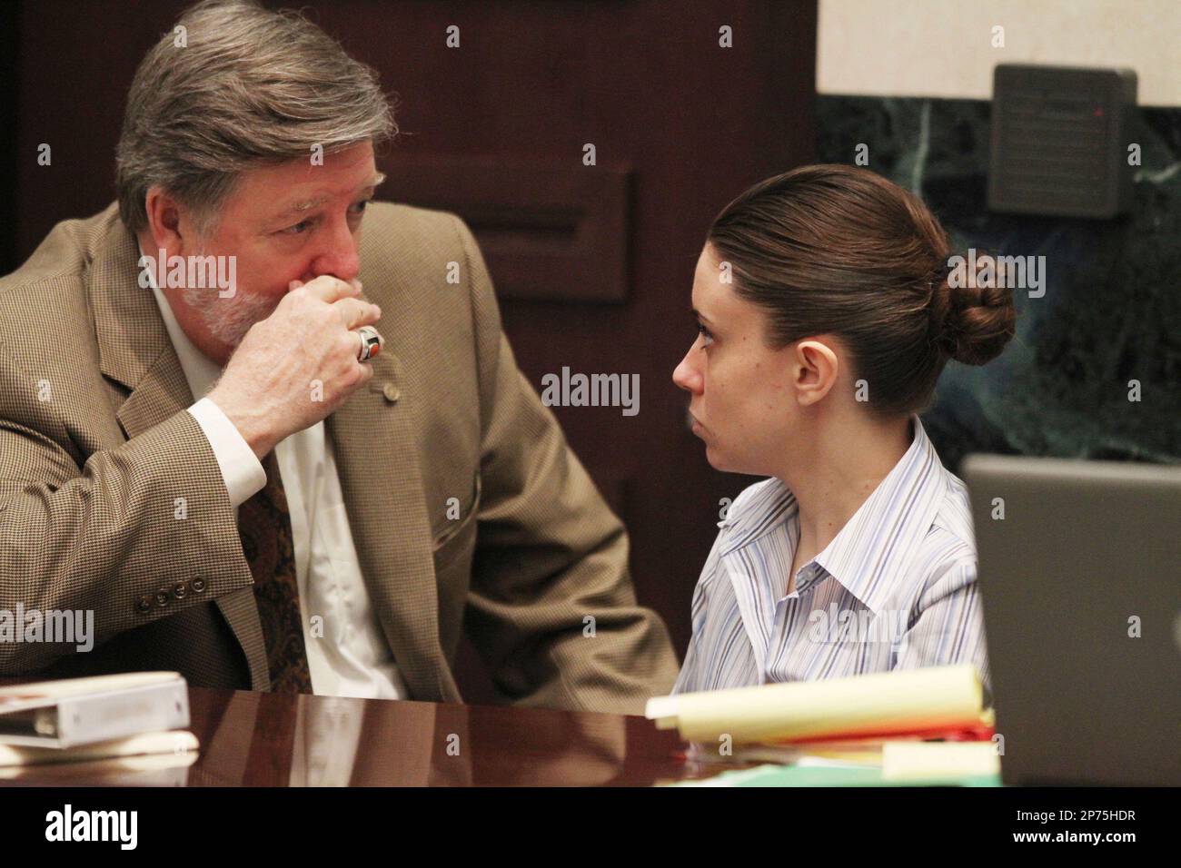 Defense attorney Cheney Mason, left, talks with his client Casey ...