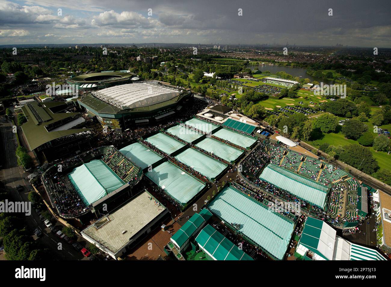 Rain covers are seen over the courts as rain stops play during the All ...