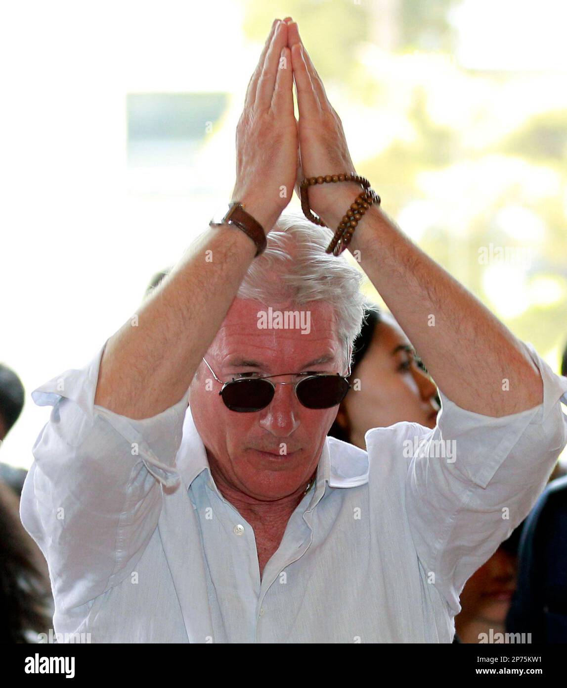 U.S. actor Richard Gere tries to bow during his visit to the Korean ...