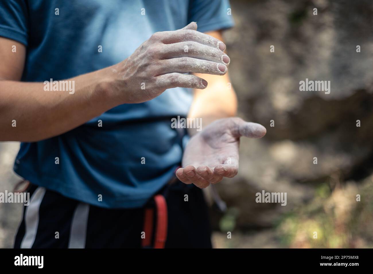 Climber clapping hands to remove the excess of magnesium Stock Photo ...