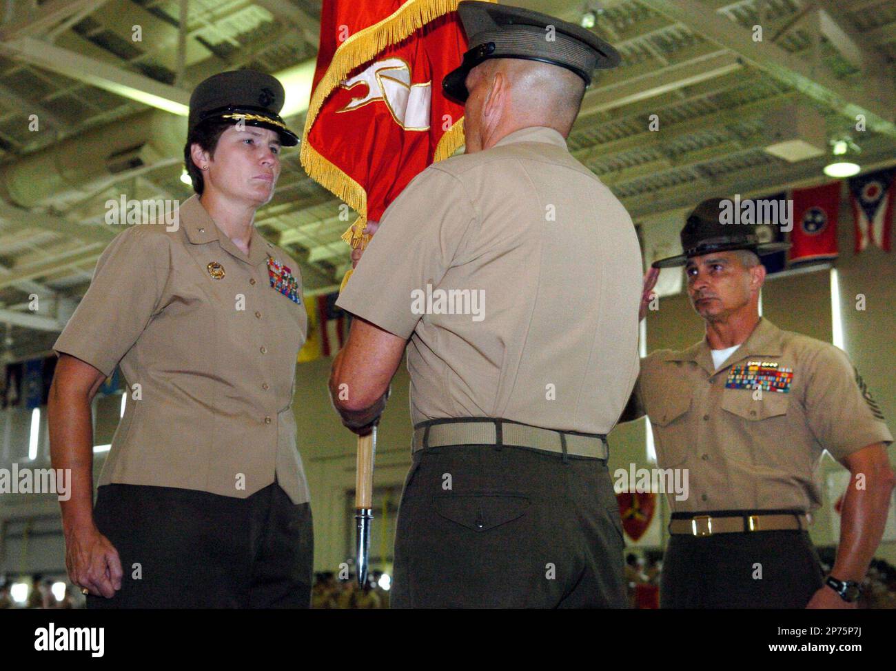 Outgoing Commanding Brig. Gen. Frederick Padilla, center, prepares to ...