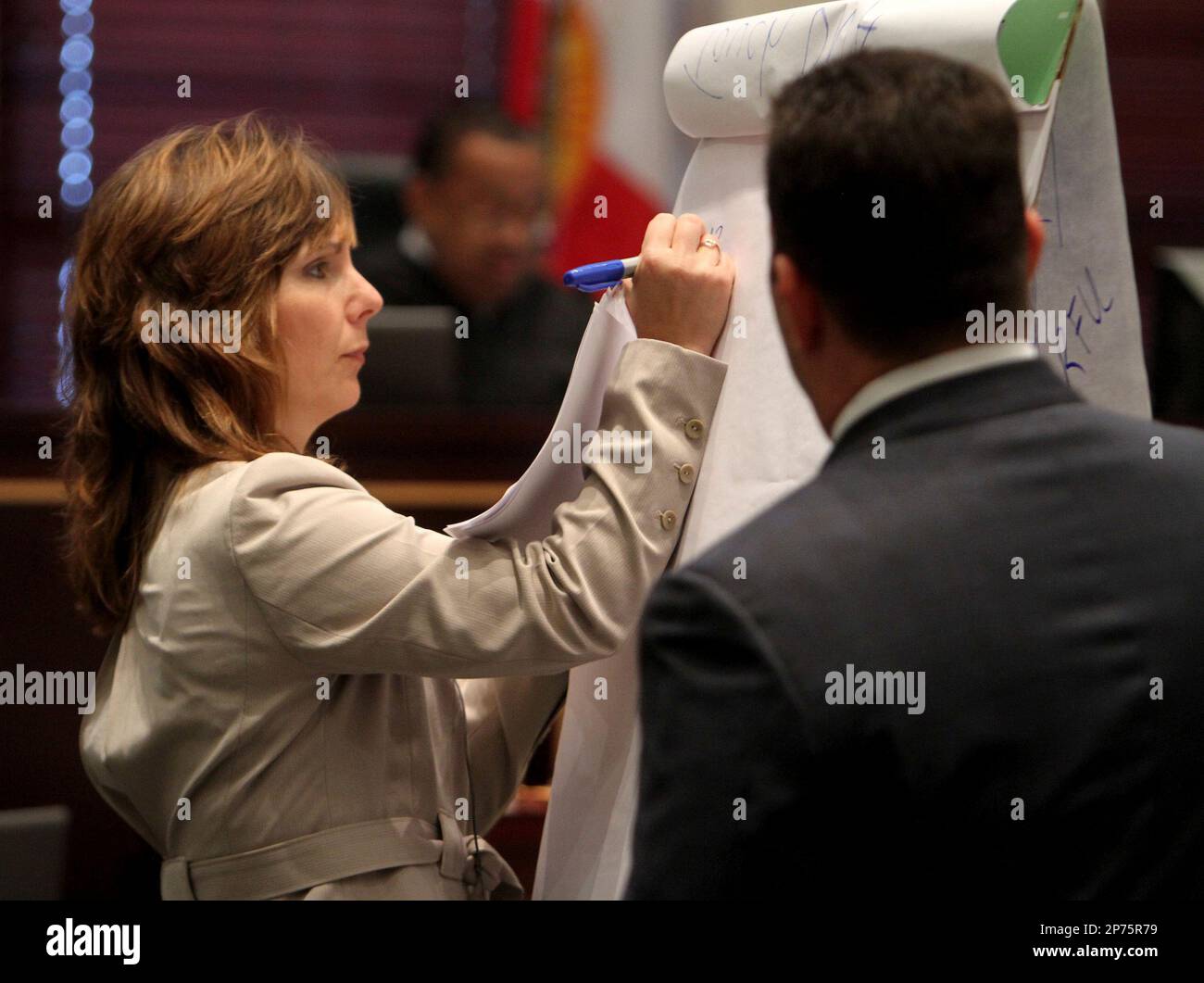 Heather Seubert, left, of the FBI lab in Quantico, Va., draws a diagram ...