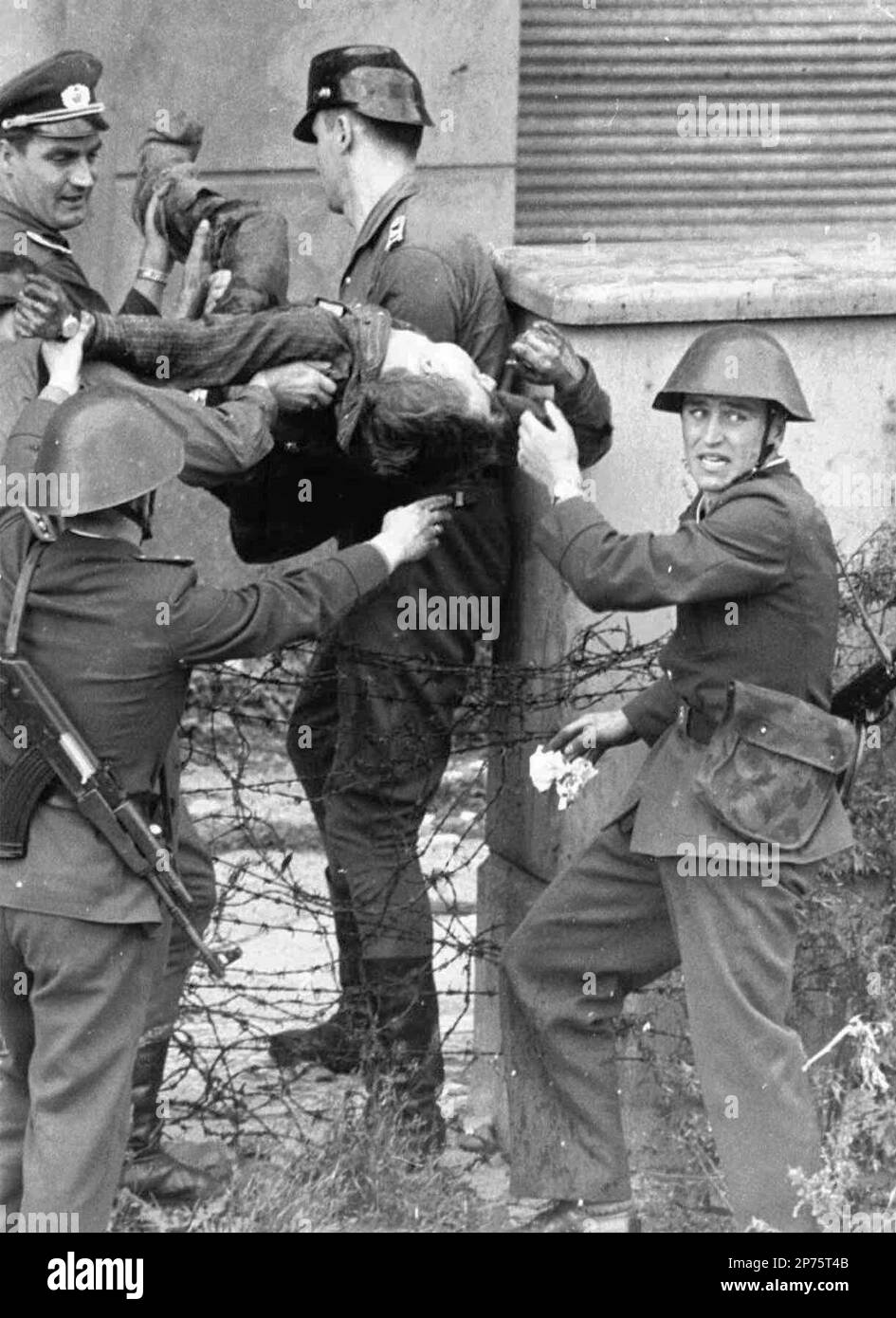 FILE - The Aug 17, 1962 photo shows dying Peter Fechter carried away by ...