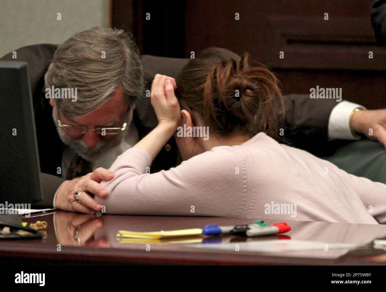 Casey Anthony, right, confers with her her attorney, Cheney Mason ...